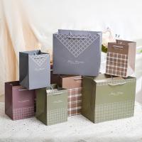 China Custom Pink 250G Kraft Paper Gift Bags with Three-Strand Rope Handles Matte Gold Logo for sale