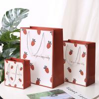 China Custom Pink Recyclable Coated Paper Clothing Bags with Ribbon Handle 30x40cm for sale