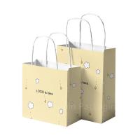 China Custom Kraft Paper Shopping Bags with Twisted String Handles Offset Printing 300gsm for sale