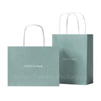 China Custom Kraft Paper Shopping Bags with Twisted String Handles Offset Printing 300gsm for sale
