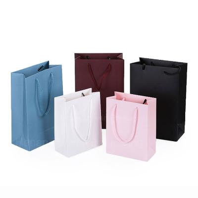 China Toowin Custom Kraft Paper Shopping Bag with Flat Handle for Perfume Retail 300gsm for sale