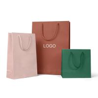 China A4 White Paper Gift Bags with Handles 250gsm Art Paper Grocery Take Out Bags for sale