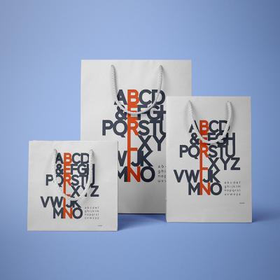 China Custom Yellow Kraft Paper Shopping Bags 250gsm Reusable Medium for Retail Clothing Gifts for sale