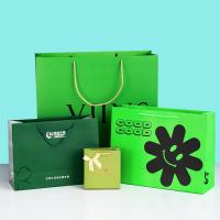 China Custom Kraft Paper Bags with Smooth Lamination and Three-Strand Rope Handles for Retail Stores for sale