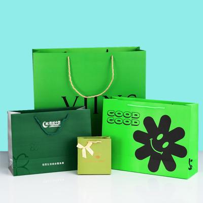 China Custom Kraft Paper Bags with Smooth Lamination and Three-Strand Rope Handles for Retail Stores for sale