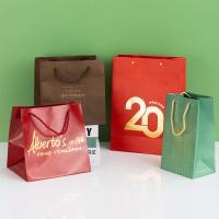China Custom Kraft Paper Bags with Smooth Lamination and Three-Strand Rope Handles for Retail Stores for sale