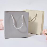 China Custom Kraft Paper Shopping Bag with Orange Paper Rope Handles for Retail Stores for sale