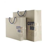 China Custom Kraft Paper Shopping Bag with Orange Paper Rope Handles for Retail Stores for sale