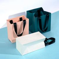 China Custom Yellow Paper Bags with Logo for Clothing Stores Kraft Paper 30x40cm for sale