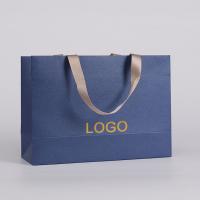 China Custom Kraft Paper Shopping Bag with Blue Rivets and Handle for Retail Gifts for sale
