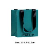 China Custom Kraft Paper Shopping Bag with Blue Rivets and Handle for Retail Gifts for sale