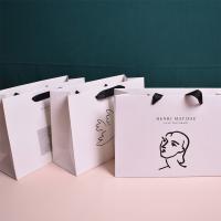 China Custom Ivory White Food Takeaway Paper Bag with Black Ribbon Handle 250gsm for sale