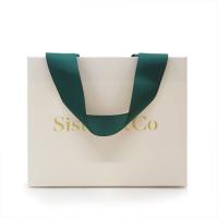 China Custom Printed Hot Foil Stamping Logo Handheld Paper Bag for Clothing Promotion 300gsm for sale