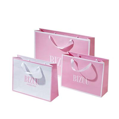 China Custom White Paperboard T Shirt Shopping Bag with Pink Hair Design 30x40cm for sale