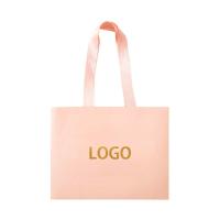 China Custom White Paperboard T Shirt Shopping Bag with Pink Hair Design 30x40cm for sale