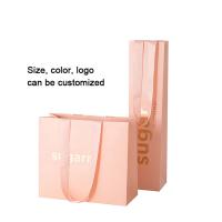 China Custom White Paperboard T Shirt Shopping Bag with Pink Hair Design 30x40cm for sale