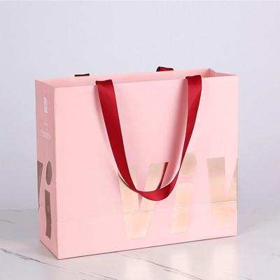 China Custom Kraft Paper Bag for Boutique Clothing Jewelry Packaging 30x20x10cm for sale