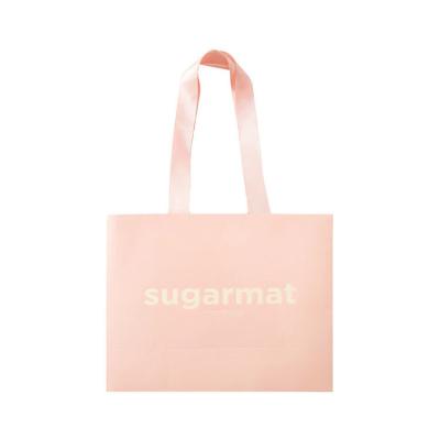 China Custom Kraft Paper Bags with Ribbon Handle Luxury Shopping Bags 300gsm for sale