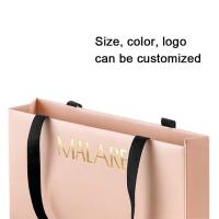 China Custom Kraft Paper Bags with Ribbon Handle Luxury Shopping Bags 300gsm for sale