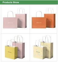 China Custom Kraft Paper Shopping Bags with Logo 300gsm Durable Retail Carry Bags for sale