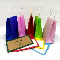 China Custom Logo Biodegradable Kraft Paper Shopping Bags 32x42cm Luxury Black Packaging for Retail Stores for sale