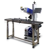 China 20w 30w Flying CO2 Laser Marking Machine With Conveyor for sale