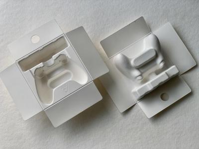 China Thermoformed Molded Pulp Game Controller Packaging - 0.8-1.0mm Thickness, Smooth Rigid Surface, 100% Biodegradable for sale