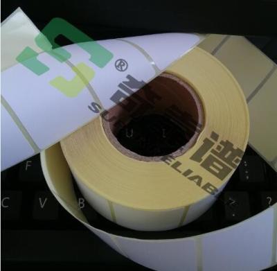 China DT Direct Thermal Adhesive Sticker 58x40mm with Yellow Glassine Liner for Industrial Labeling Applications for sale