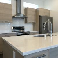 China Upgrade Your Kitchen with Top Veneer and Lacquer Finish Modern White Island Cabinets for sale
