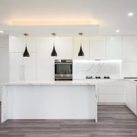 China Customized White Matte Kitchen Cabinets with Spice Basket and Quartz Stone Countertop for sale