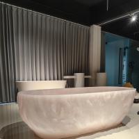 China Mold Resistant Bathroom Solid Surface Bathtub Volcanic Rock Effect Stand Alone for sale