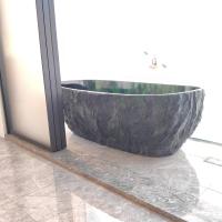 China Luxury Volcanic Stone Solid Surface Bathtub Green Resin Freestanding Soaker 60 Inch for sale