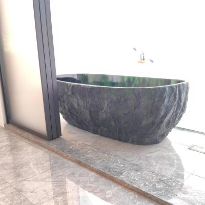 China Luxury Volcanic Stone Solid Surface Bathtub Green Resin Freestanding Soaker 60 Inch for sale