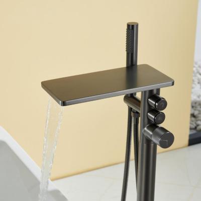 China Modern Gunmetal Grey Freestanding Waterfall Bathtub Faucet with Storage Shelf & Handheld Shower bath sanitary ware for sale