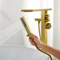 China Modern Brushed Gold Freestanding Bathtub Faucet Solid Brass Waterfall Tub Filler with Handheld Shower bath sanitary ware for sale