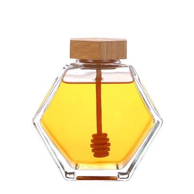 China Hexagonal Glass Honey Jam Jar 100ml 220ml 380ml with Wooden Spoon and Bamboo Cork for sale