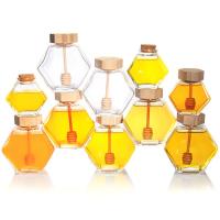 China Wholesale Hexagonal Glass Honey Jar 100ml 220ml 380ml with Wooden Lid and Dipper for sale