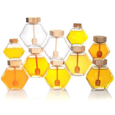 China Wholesale Hexagonal Glass Honey Jar 100ml 220ml 380ml with Wooden Lid and Dipper for sale