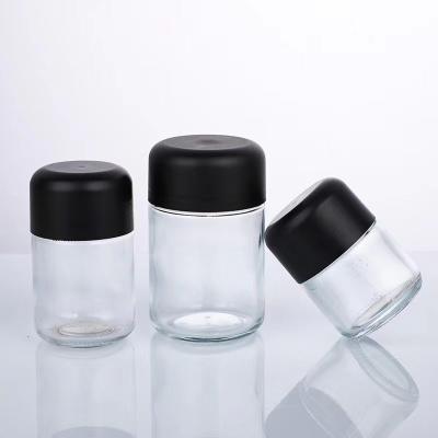 China Airtight Clear Child Resistant Glass Jar 70ml 180ml Flower Packaging with CR Cap for sale
