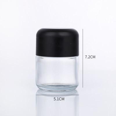 China Clear Child Resistant Glass Jar 70ml to 180ml Smell Proof Round Flower Container with Honeycomb Pattern for sale