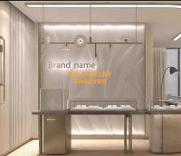 China Curved Commercial Jewellery Display Cases Stainless Steel Golden Style for sale