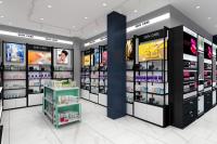 China Customized Durable Metal Cosmetic Display Shelves With Big Cab Lightbox for sale