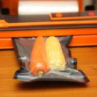 China Custom Plastic Black Vacuum Sealer Bags Rolls Embossed Kitchen Food Packaging for sale