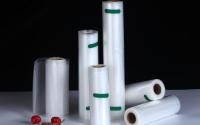 China Customized Size QS Embossed Vacuum Sealer Rolls BPA Free Food Vacuum Storage Bags for sale