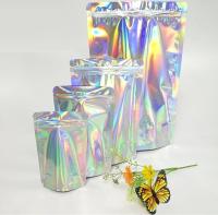 China Holographic Pouch Brightly Custom Printing Logo Laser Three Side Sealed Bag For Lip Eyelash Glue Hairpin for sale