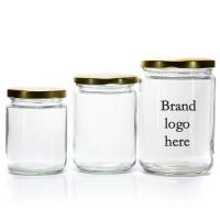 China Custom Logo Wholesale Food Grade Transparent Round Food Storage Glass Container Jar With Screw Metal Lid for Food Packing for sale