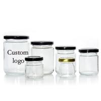 China Custom Logo Clear Round Shape Food Storage Canning Pickles Food Glass Jars Food Grade Container With Metal Lids for sale