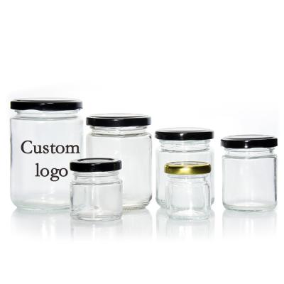 China Custom Logo Clear Round Shape Food Storage Canning Pickles Food Glass Jars Food Grade Container With Metal Lids for sale