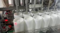China Automatic Wet Wipes Liquid Dosing Filling Machine with 12-Head Net Weight Filling and Anti-Foaming System for sale