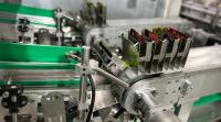 China Automatic Gummy Candy Sachet Vertical Cartoning Machine with Magazine Counting and Servo Transfer System for sale